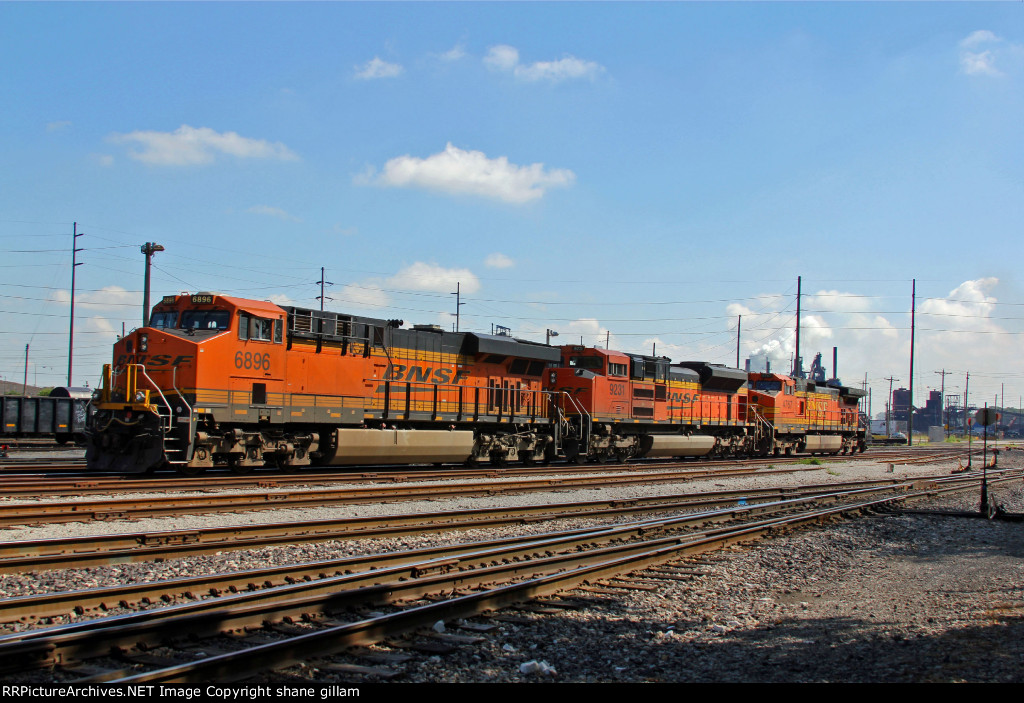 BNSF 6896 sits and waits for the ore train to be unloaded.